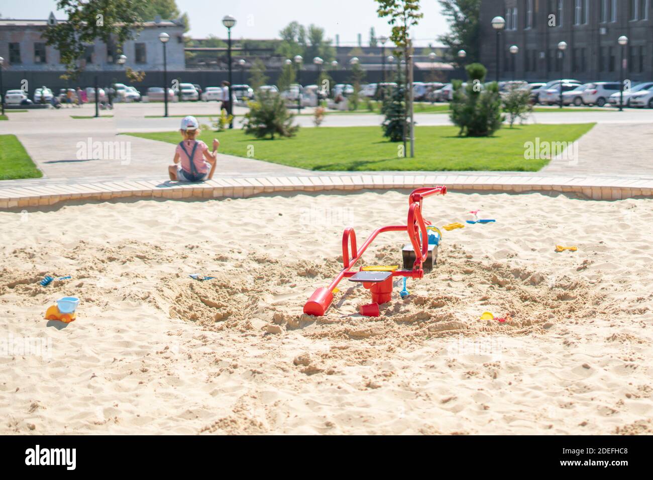 the sandbox in the public place in the street, town park with ...