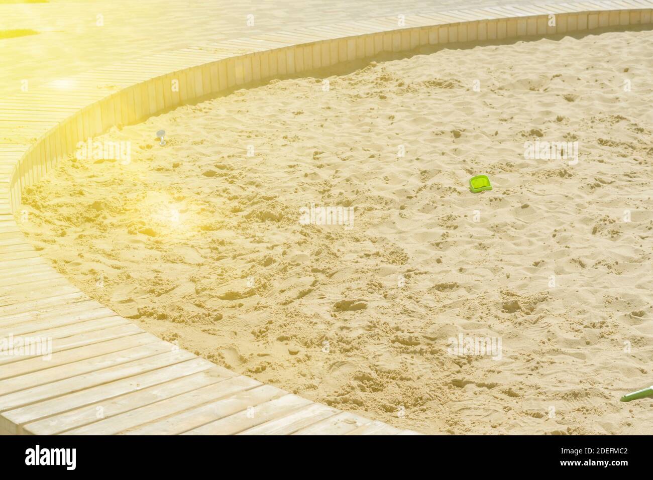the sandbox in the public place in the street, town park with ...