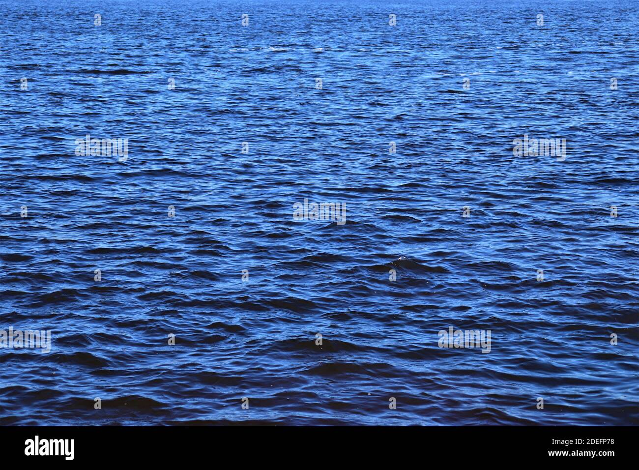 Small waves on the ocean surface, ripples on the water surface, bright ...