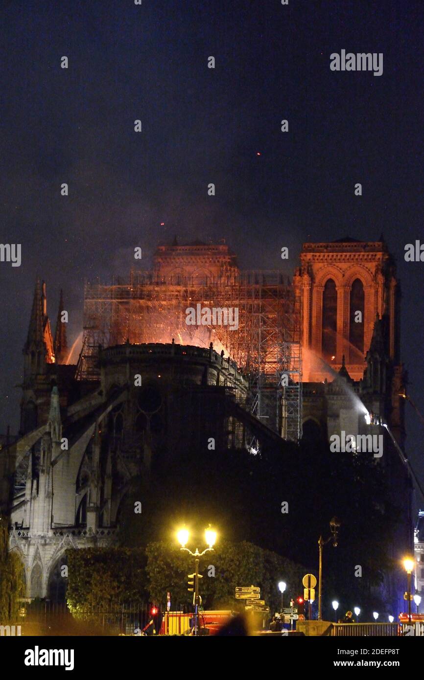 Smoke and flames rise during a fire at the landmark Notre-Dame ...