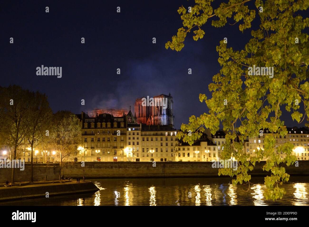 Smoke and flames rise during a fire at the landmark Notre-Dame ...