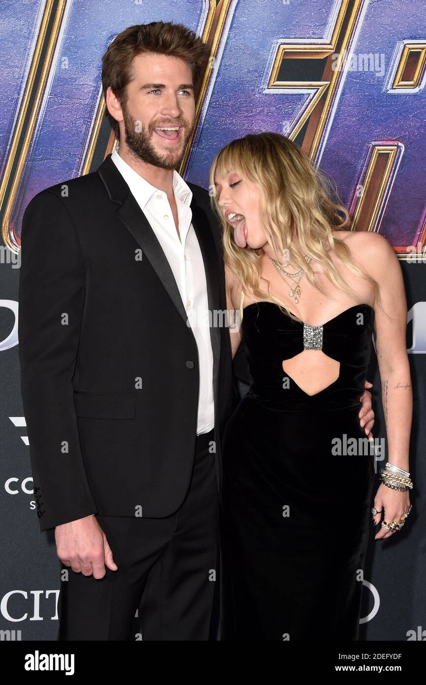 Liam Hemsworth and Miley Cyrus attend the world premiere of Walt Disney ...