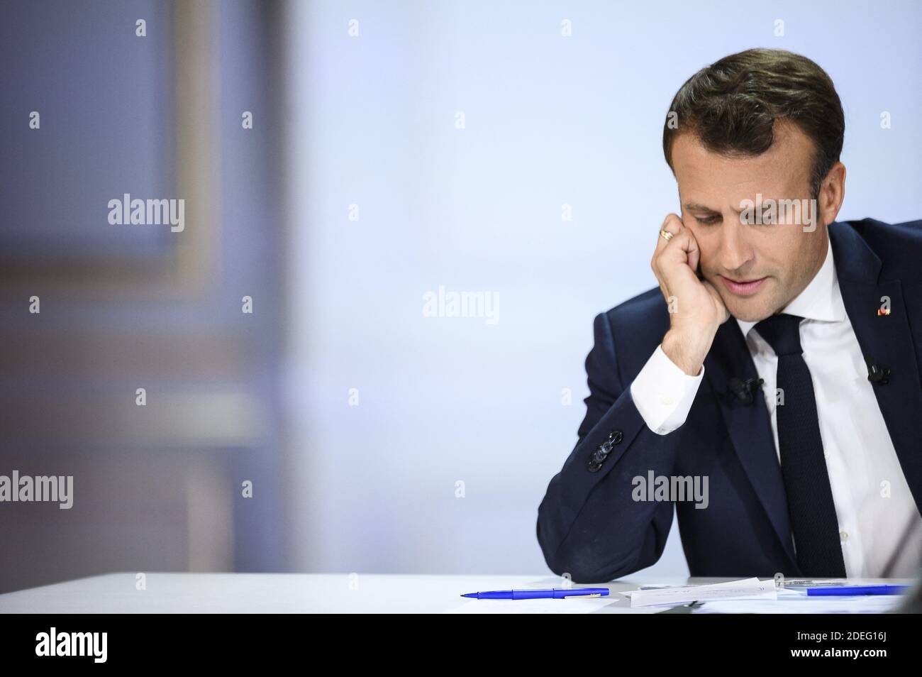 French President Emmanuel Macron gestures during his live address ...