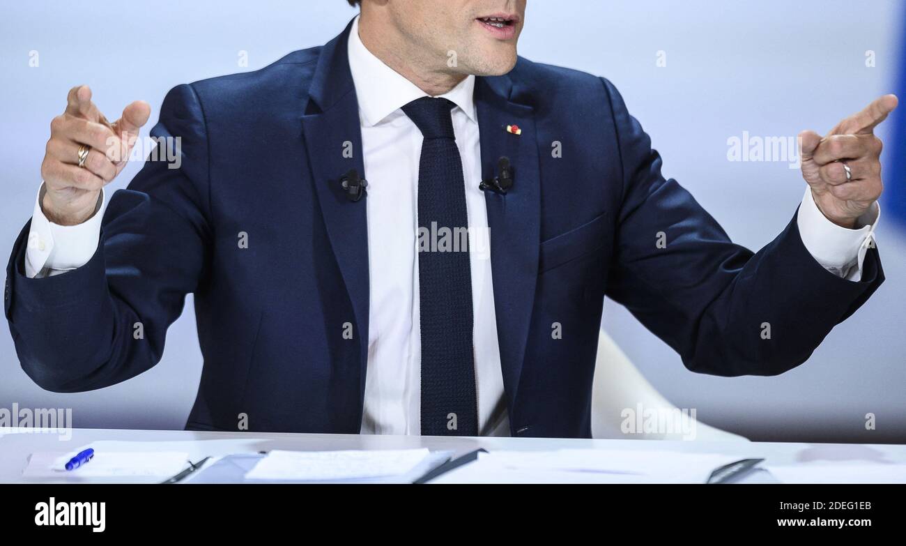 French President Emmanuel Macron gestures during his live address ...