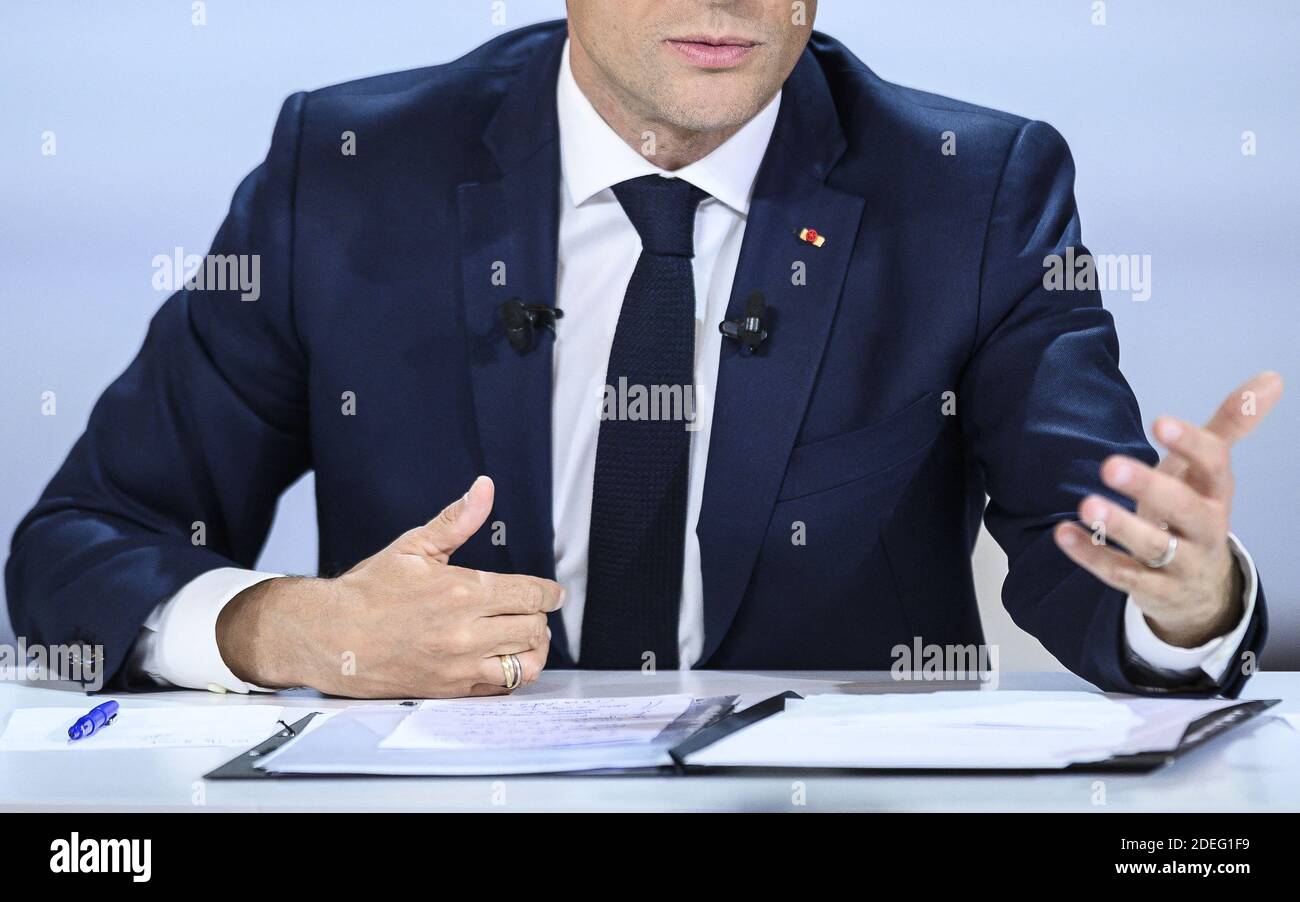 French President Emmanuel Macron gestures during his live address ...