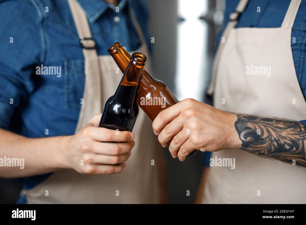 Male brewery worker tasting beer, standing in plant Stock Photo - Alamy