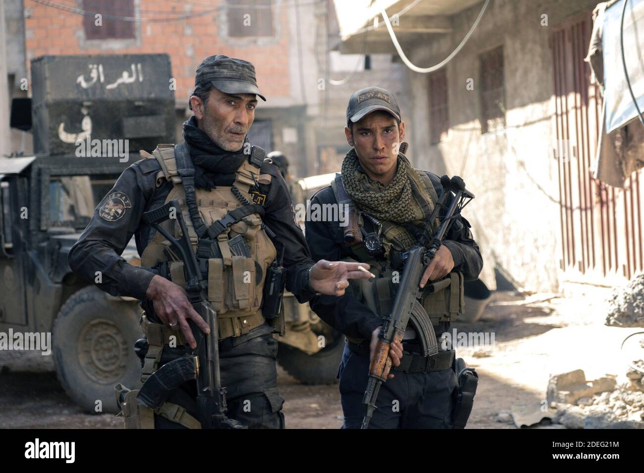 MOSUL, from left: Suhail Dabbach, Adam Bessa, 2019. ph: Jose Haro ...