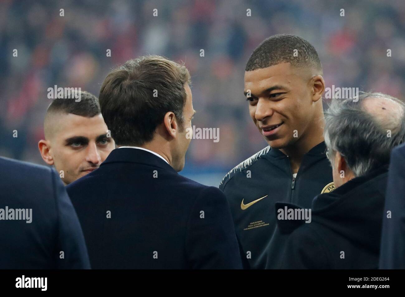 France's President Emmanuel Macron greeting PSG's Kylian Mbappe during ...