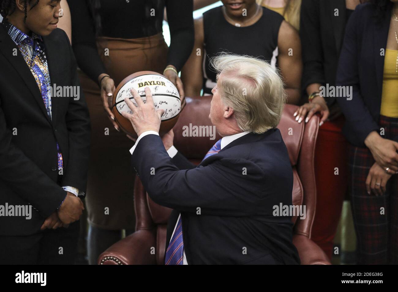 President Donald Trump receives a signed basketball as he welcomes the ...