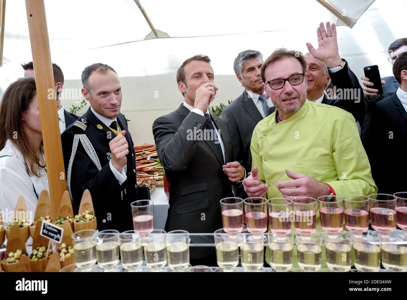 French President Emmanuel Macron and first lady Brigitte Macron receive ...