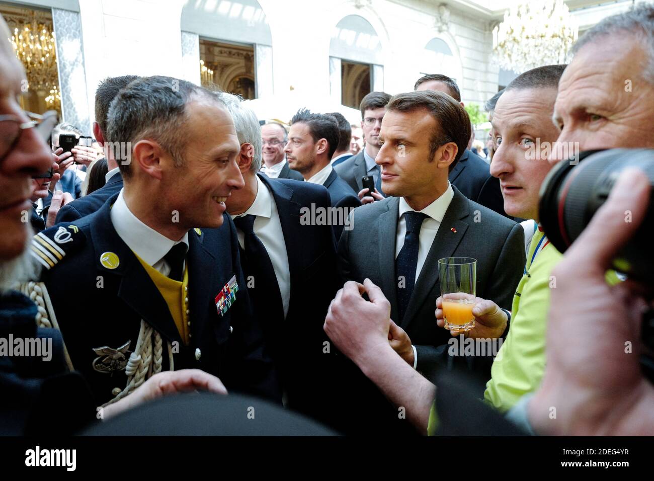French President Emmanuel Macron and first lady Brigitte Macron receive ...