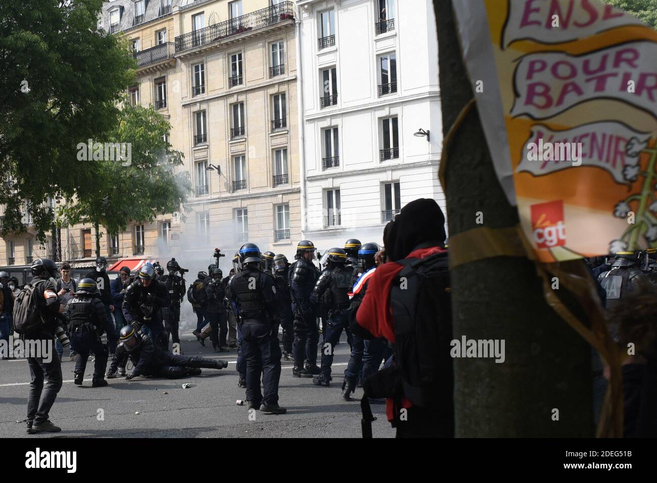 Police officer falls during annual may day protests in Paris on May, 1 ...