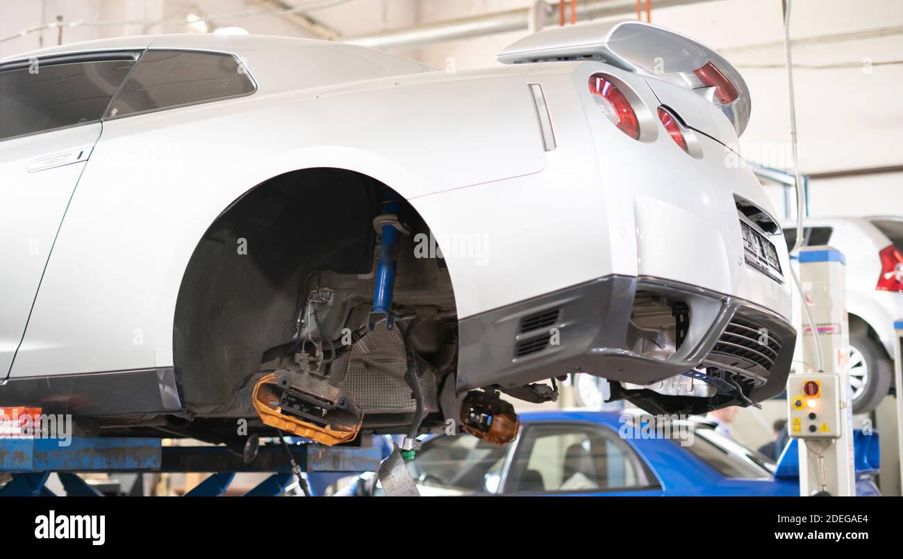 the disassembled car parts in the auto workshop, machine service ...