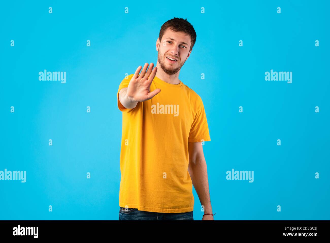 Shocked man with disgusted face showing stop sign Stock Photo - Alamy