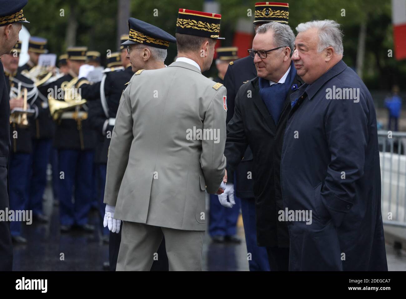 Richard Ferrand and Gerard Larcher attend a ceremony in front of the ...