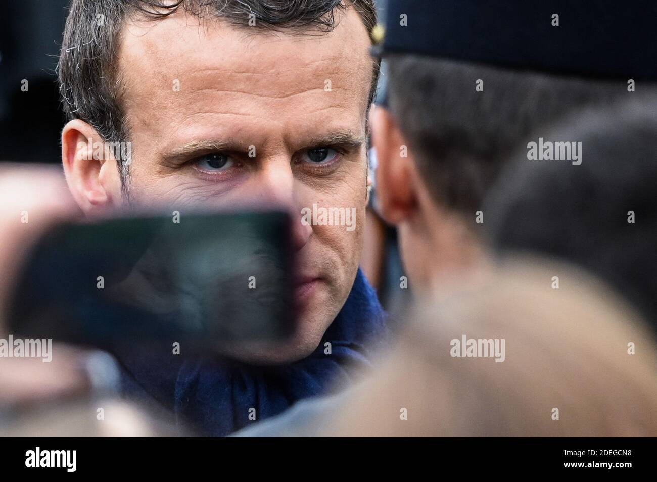 French President Emmanuel Macron looks on during a wreath laying ...