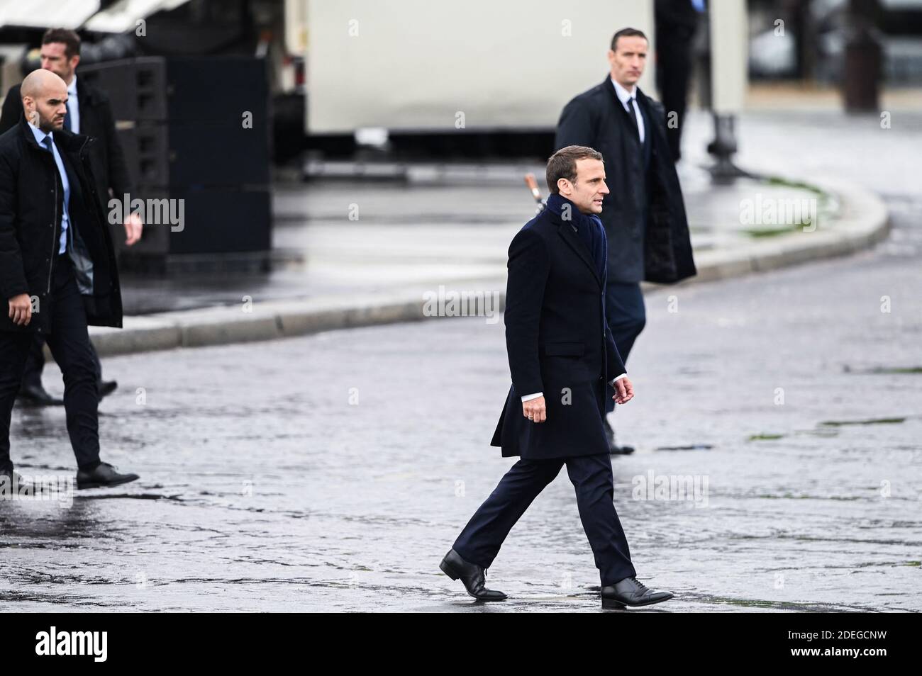 French President Emmanuel Macron walks during a wreath laying ceremony ...