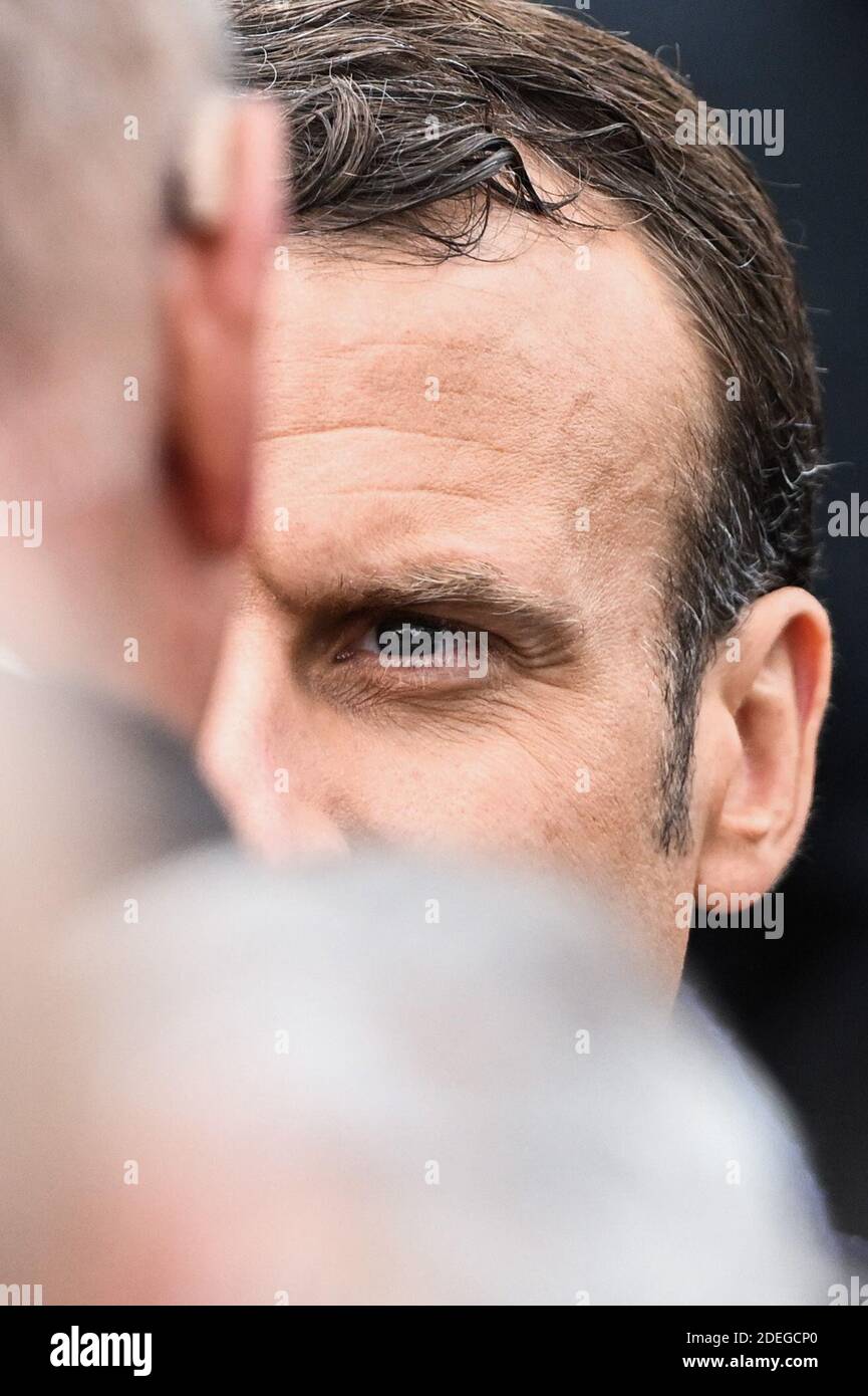 French President Emmanuel Macron looks on during a wreath laying ...