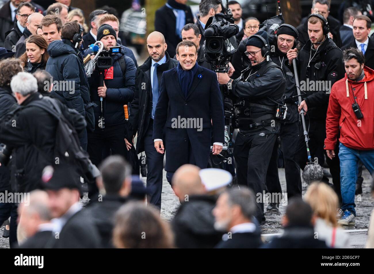 French President Emmanuel Macron smiles during a wreath laying ceremony ...
