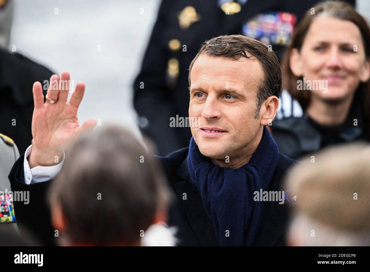 French President Emmanuel Macron smiles during a wreath laying ceremony ...