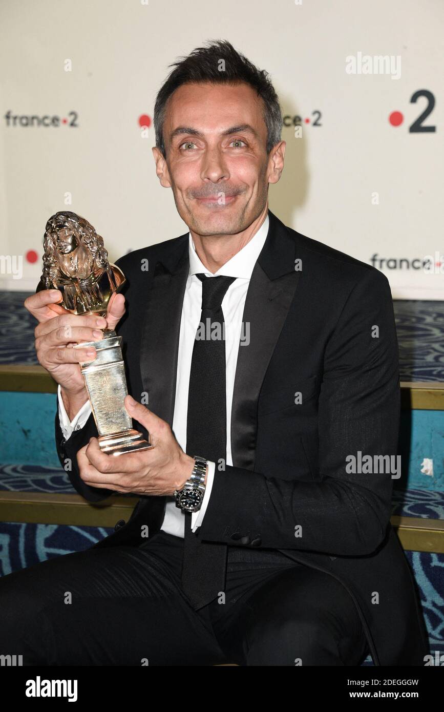 Benoit Soles posing with his award for 'La machine de Turing' during ...