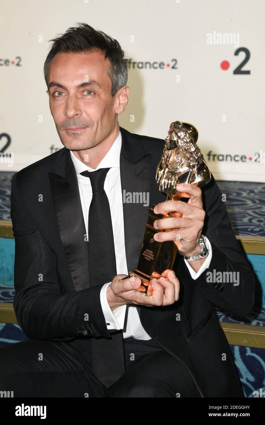 Benoit Soles posing with his award for 'La machine de Turing' during ...