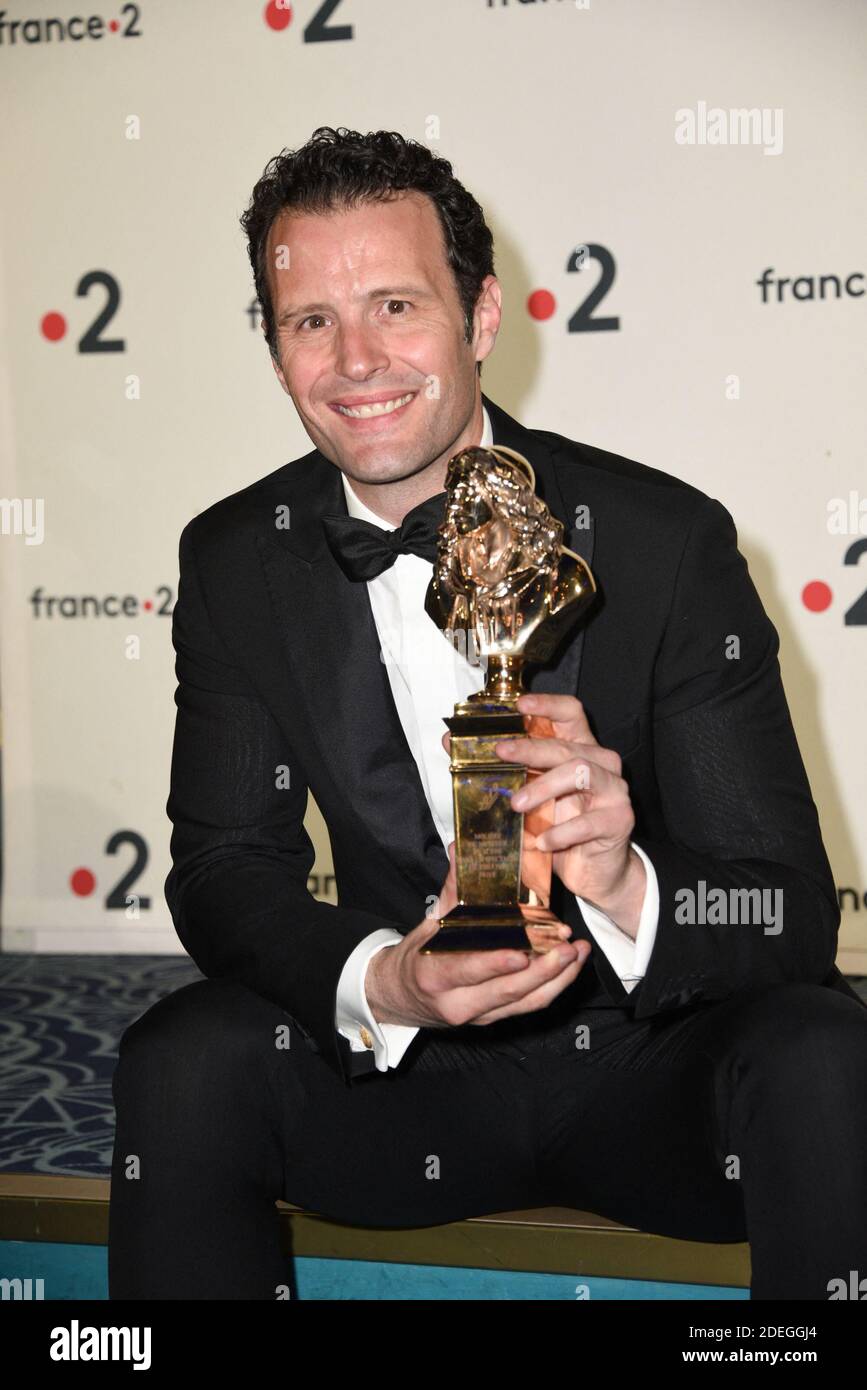 Tristan Petitgirard posing with his award for 'La machine de Turing ...