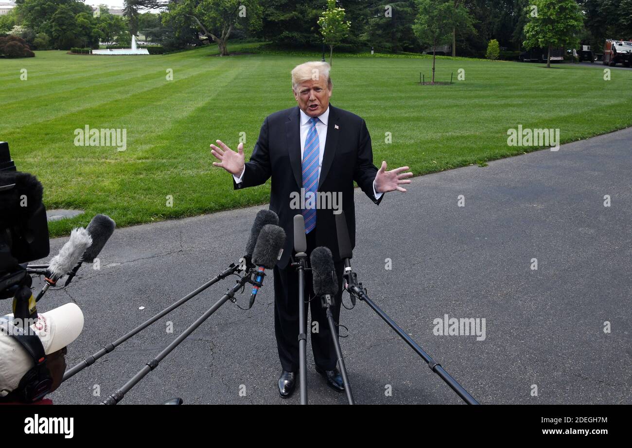 U.S. President Donald Trump answers questions from reporters before ...
