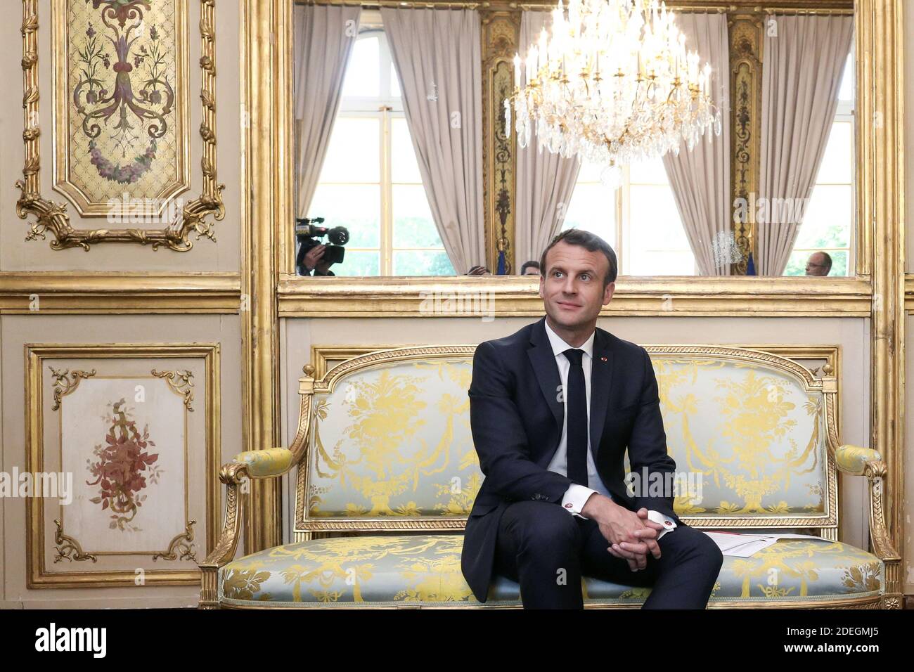 French President Emmanuel Macron meets with CEO of ride hailing app ...