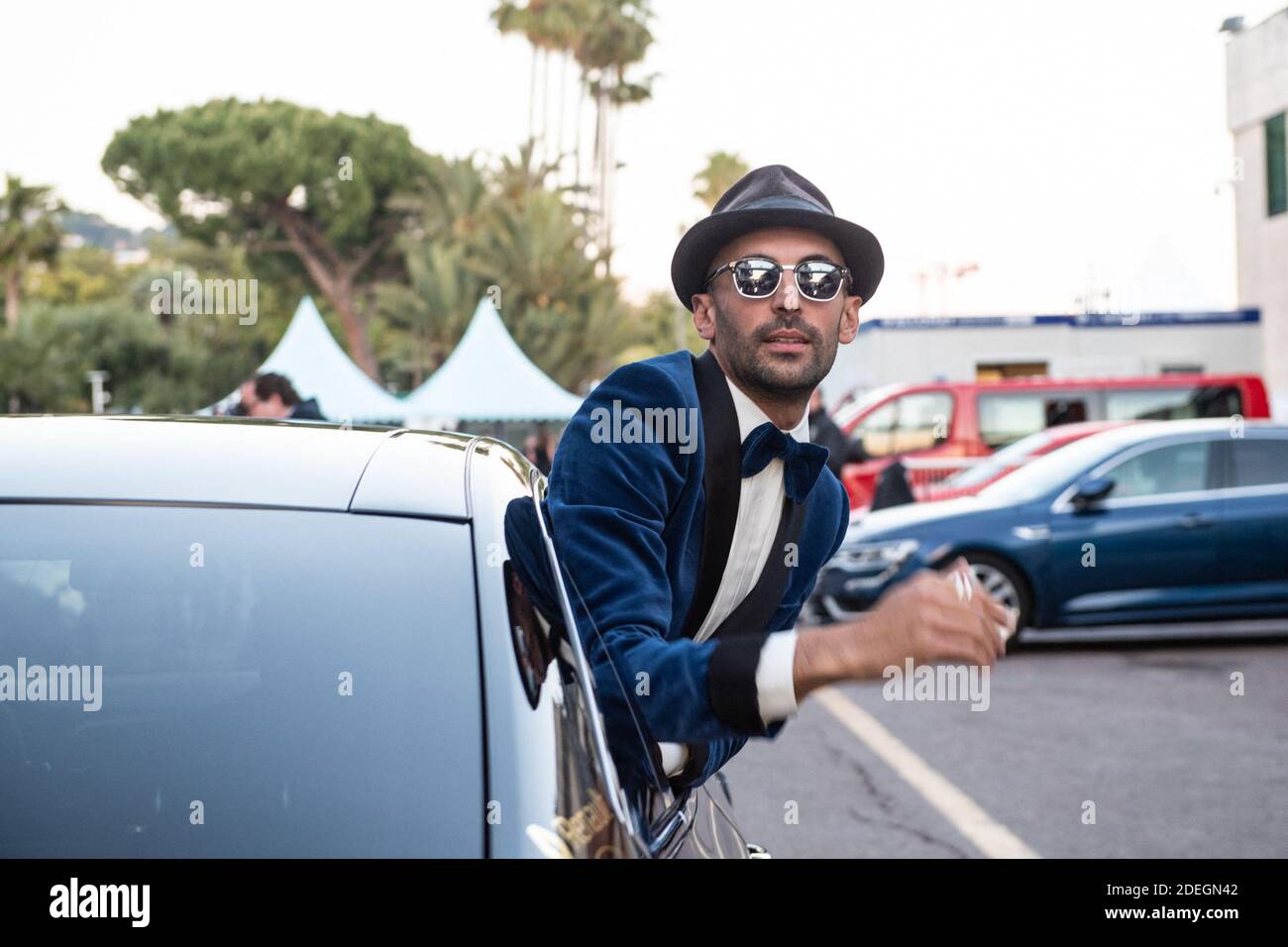 Artist and photographer known as JR leaves the screening of Les ...