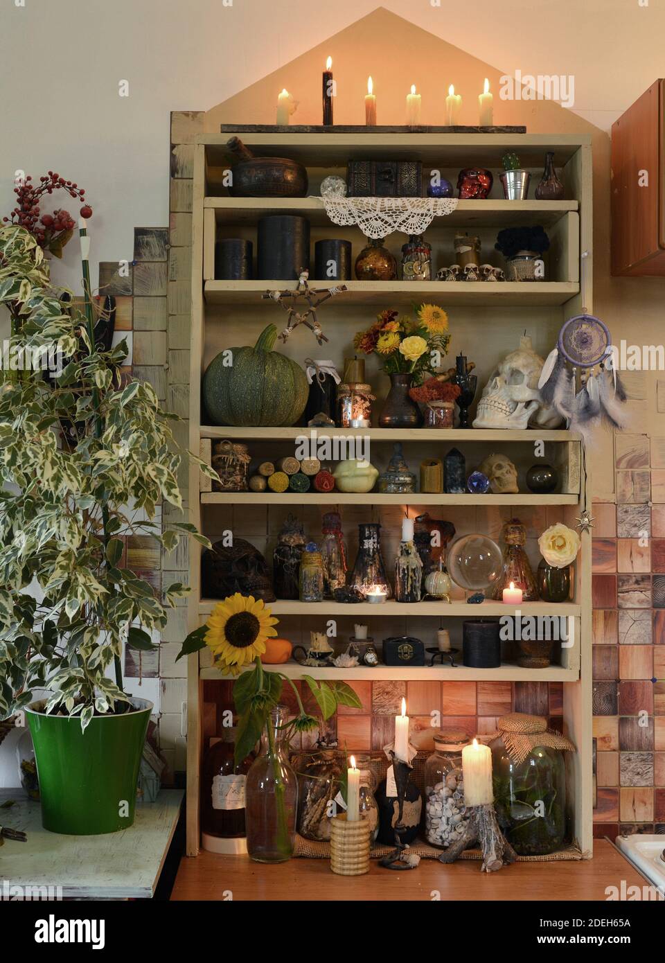 Still life with bottles, crystals, magic objects and burning candles on ...