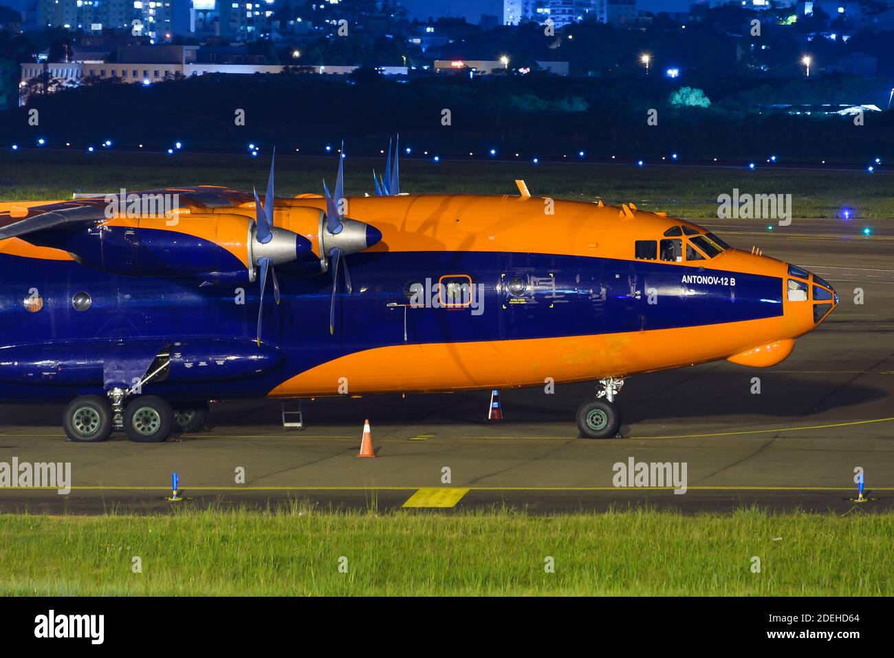 Cavok Air Antonov 12 parked at night. Cargo airplane Antonov An-12 (An ...