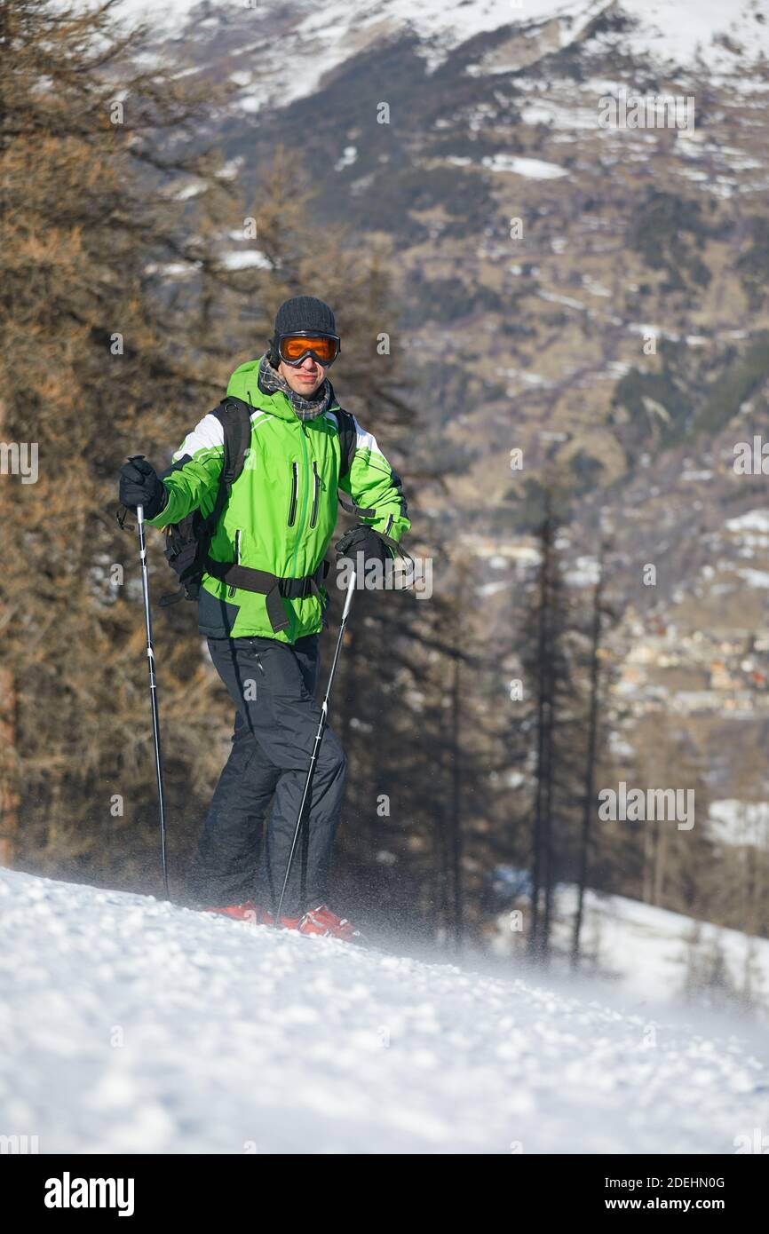 Skiing in the winter snowy slopes Stock Photo - Alamy