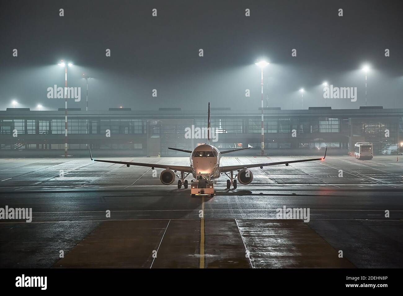 Airliner at an airport at night Stock Photo - Alamy