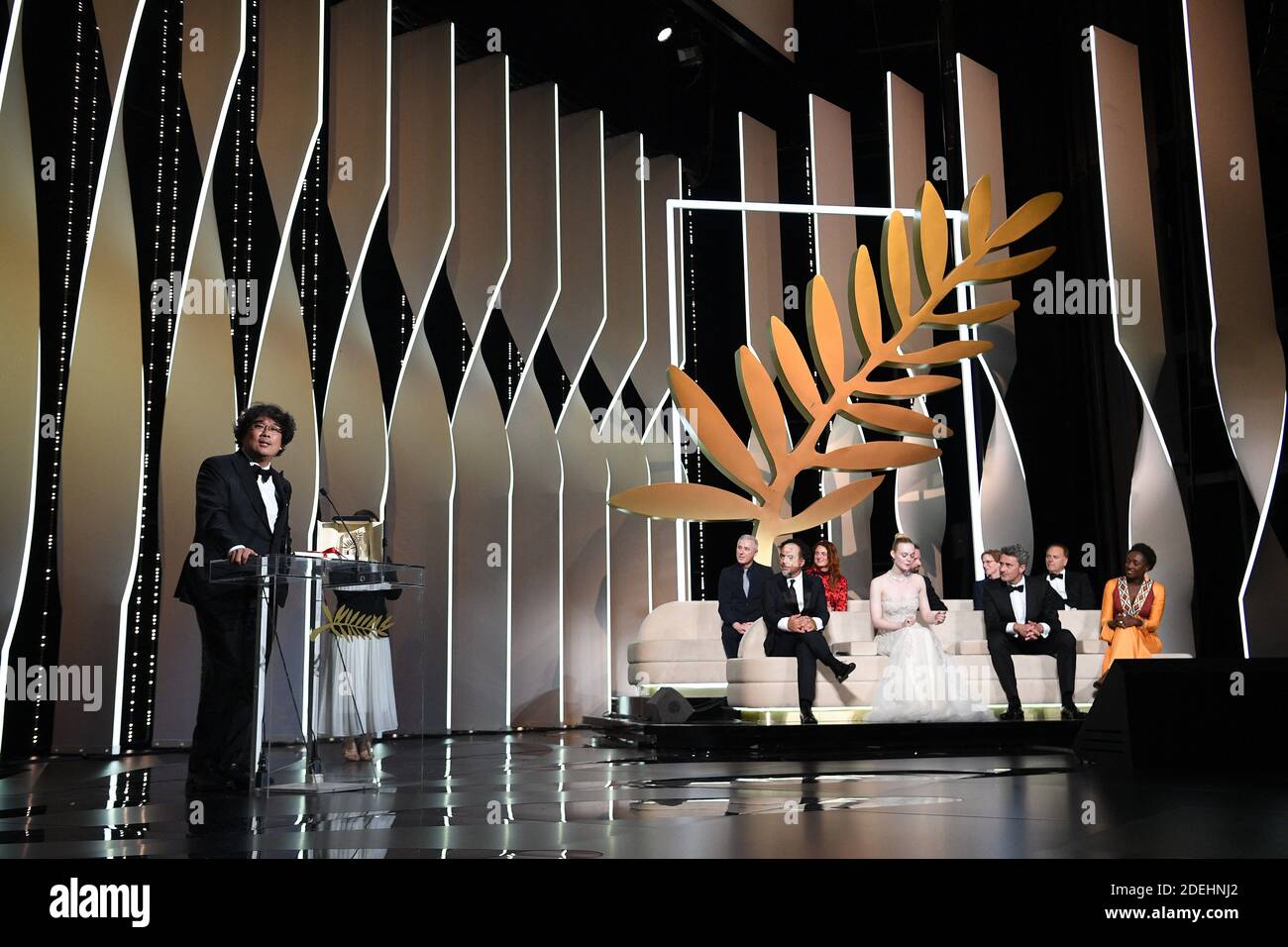 Bong Joon-Ho celebrates after receiving the Palme d'Or award for the ...