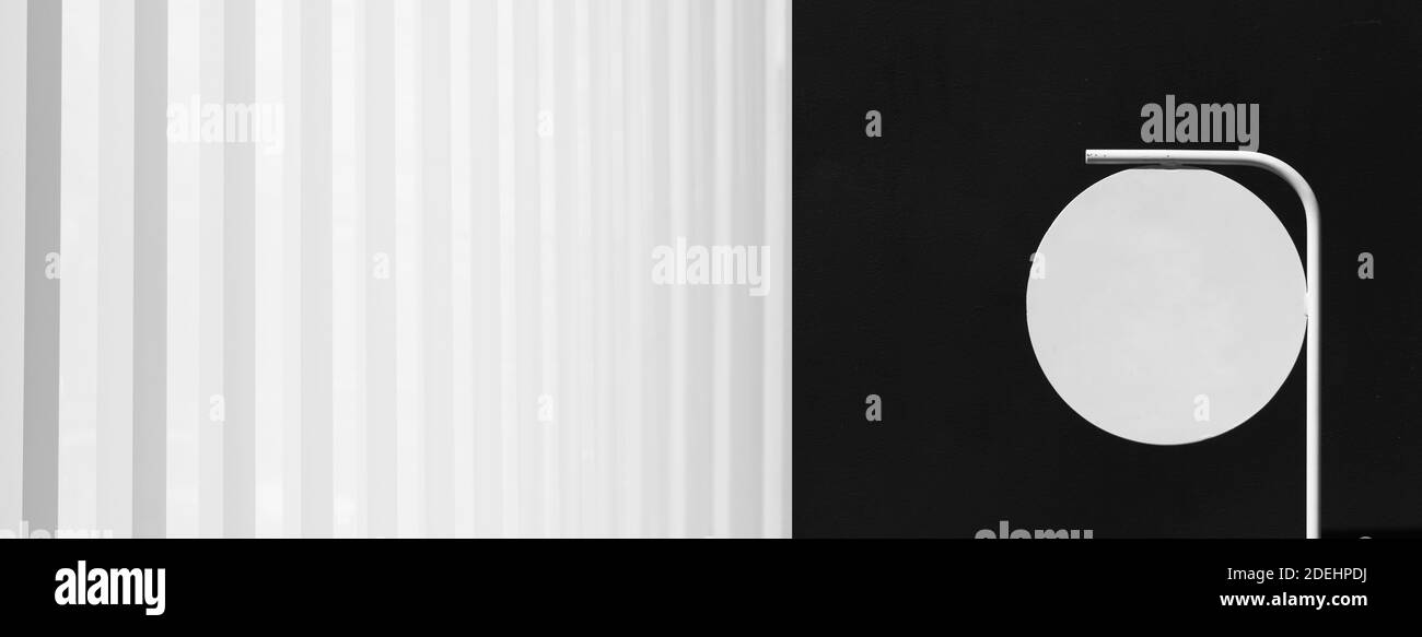 white round hanging label on black wall and modern design line of ...