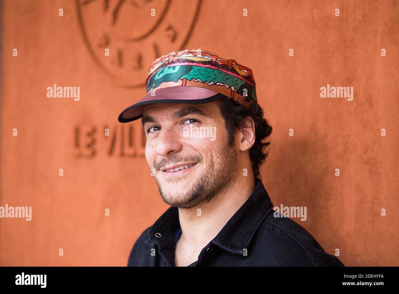 Amir Haddad in Village during French Tennis Open at Roland-Garros arena ...