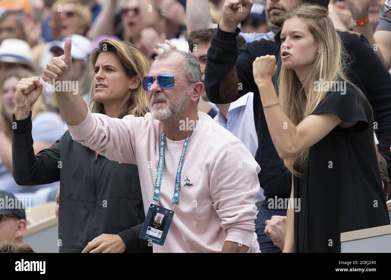 Amelie Mauresmo, Loic Courteau and Clemence Bertrand in stand during ...