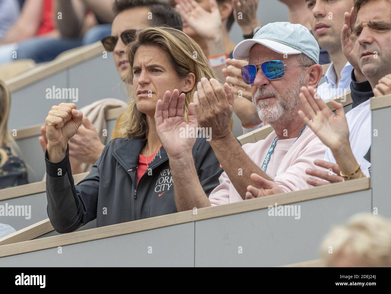 Amelie Mauresmo and Loic Courteau in stand during French Tennis Open at ...