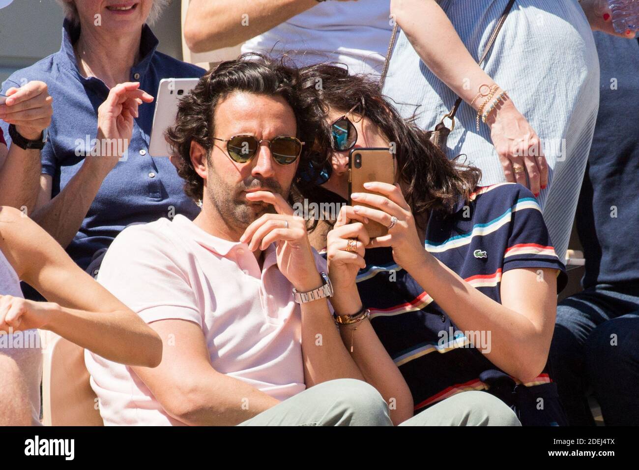 Laurie Cholewa and her companion Greg Levy in stands during French Tennis Open at Roland-Garros ...