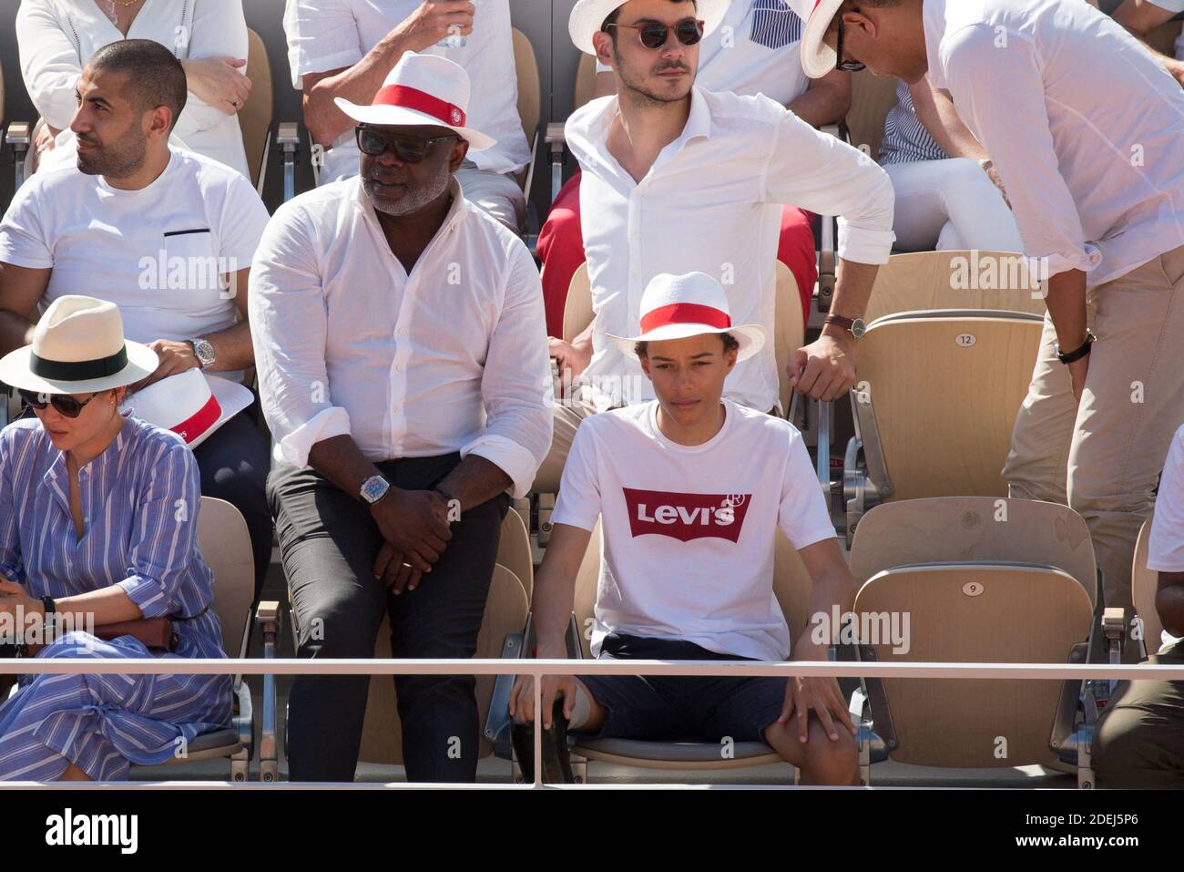 Basile Boli and his nephew Thomas in stands during French Tennis Open ...