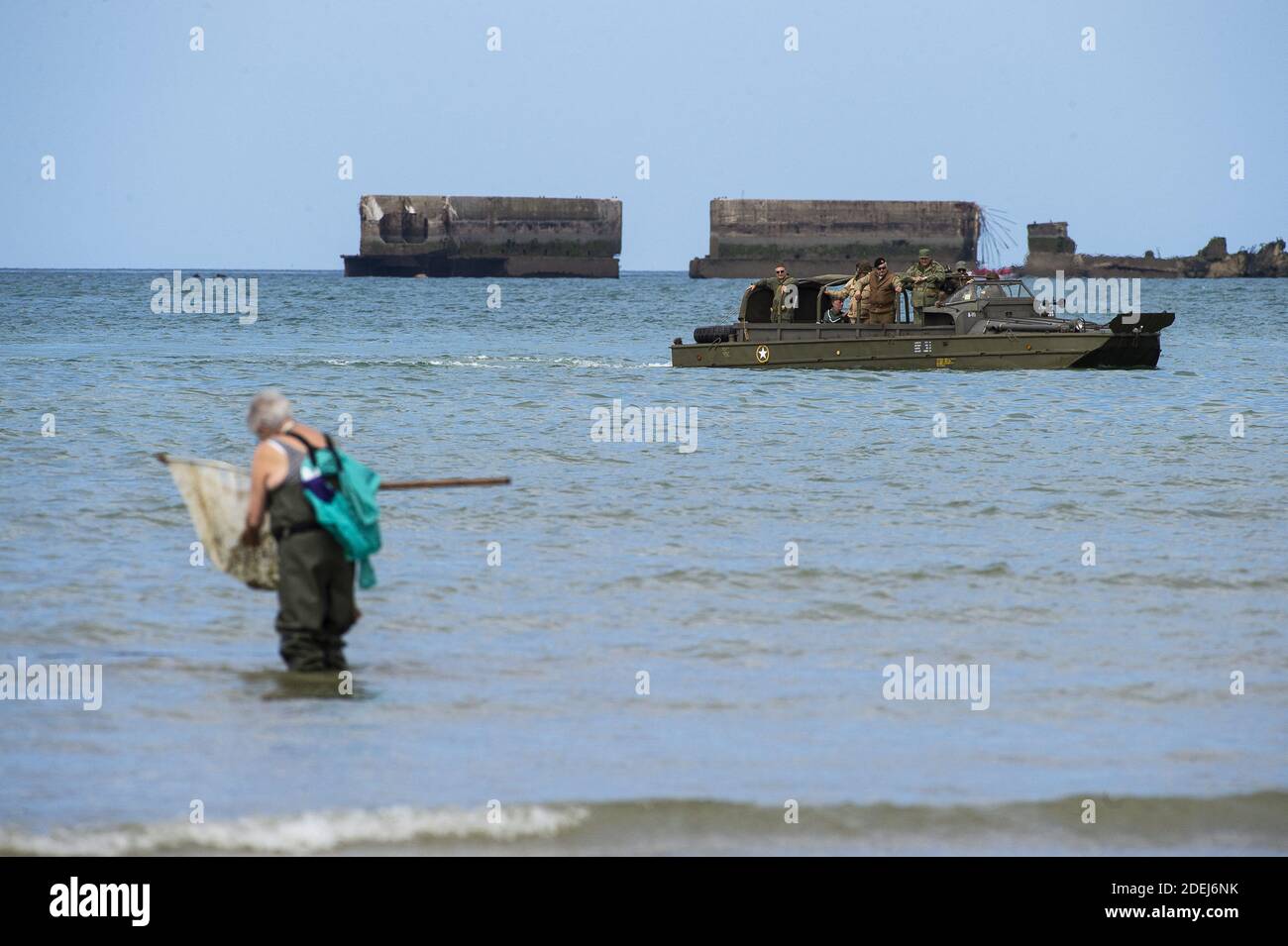 Shrimp fisherman with old us army amphibious vehicle at Arromanches, in ...
