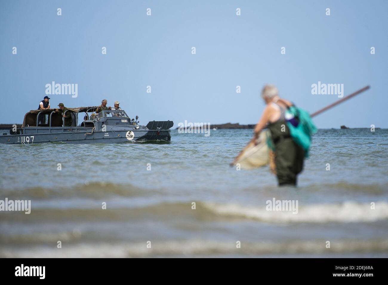 Shrimp fisherman with old us army amphibious vehicle at Arromanches, in ...