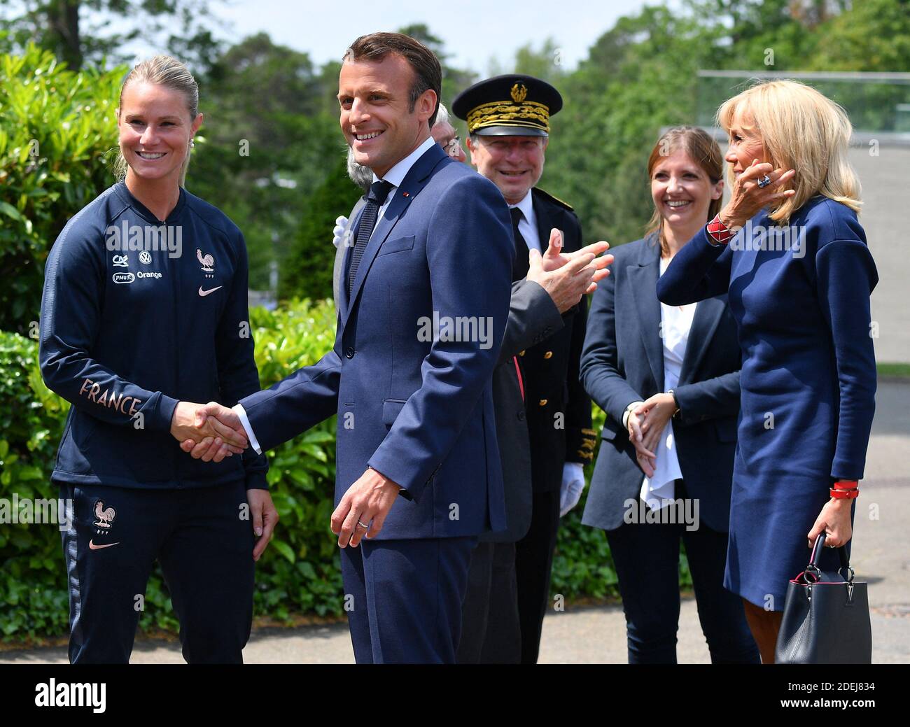 French President Emmanuel Macron shakes hands with France's midfielder ...