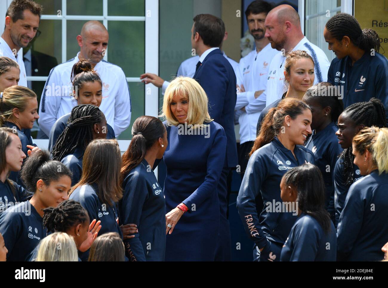 French President Emmanuel Macron and first lady Brigitte Macron shake ...