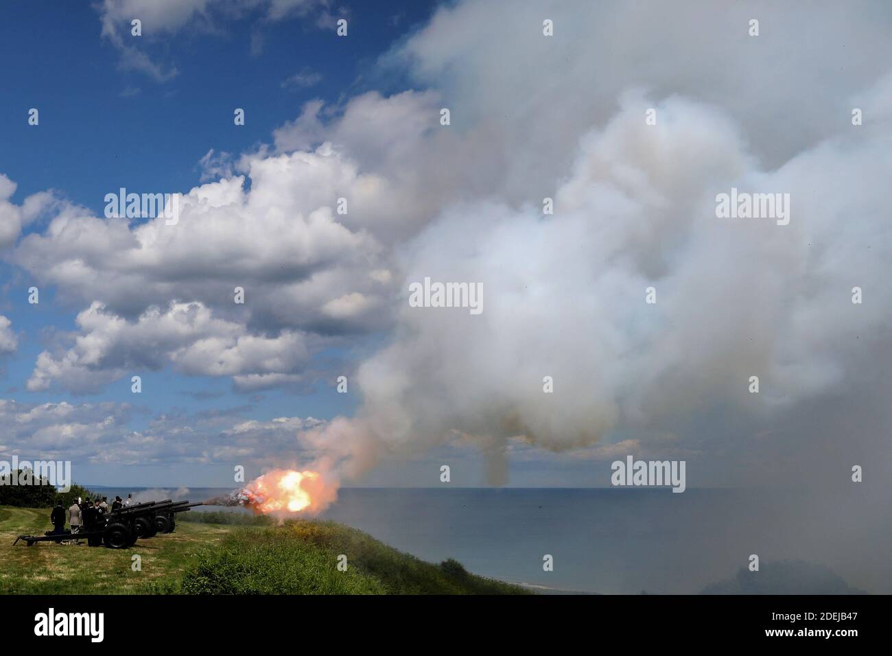 A 21-gun salute after a French-US ceremony at the Normandy American ...