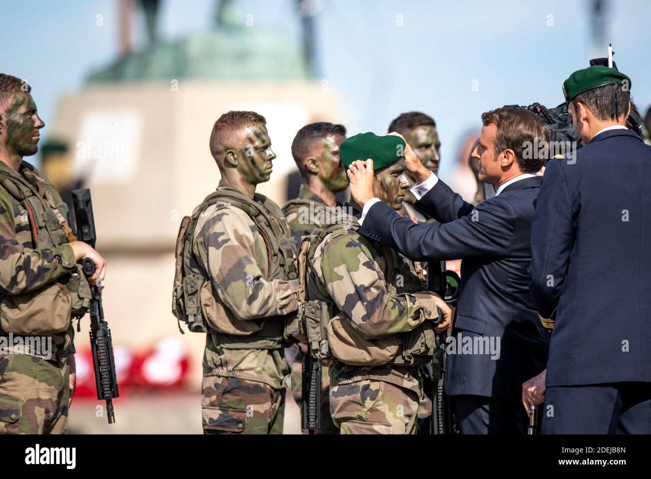 French President Emmanuel Macron gives a " Green Beret " to a graduate ...