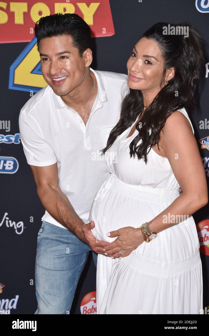 Mario Lopez, Courtney Laine Mazza attend the premiere of Disney and ...
