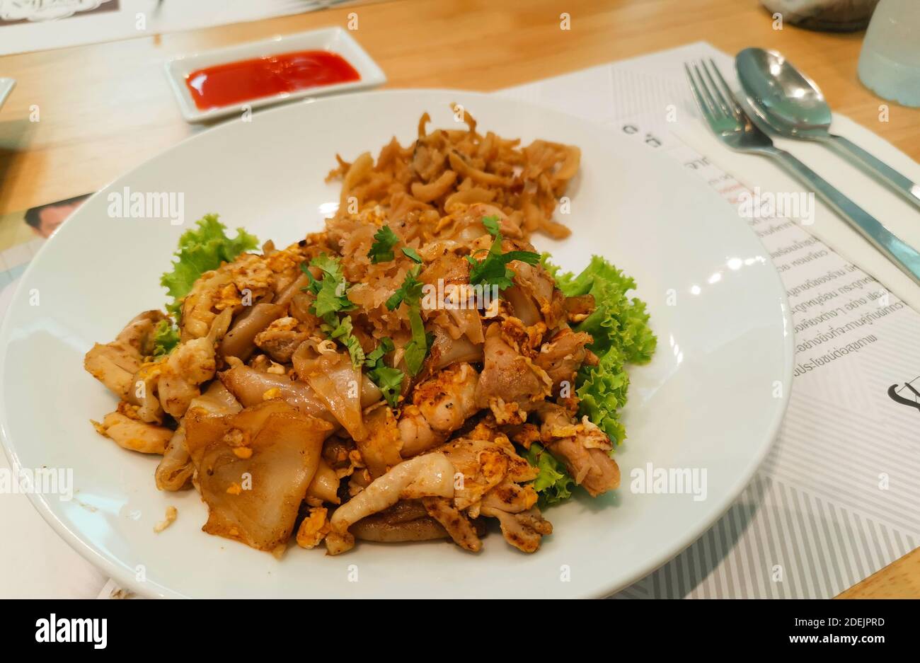 Stir-fried noodles with chicken, popular fast food in Thailand Stock ...
