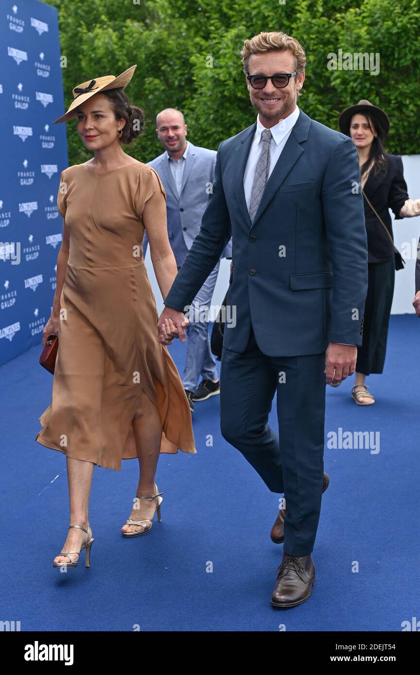 Actor Simon Baker and his wife Rebecca Rigg attend the Prix De Diane ...